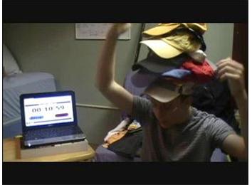 Most Hats Put On In Fifteen Seconds | World Record | Alex Cunningham