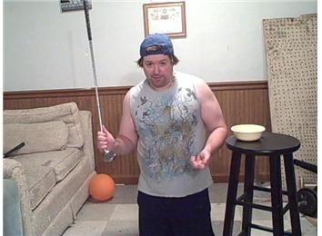 Tallest Penny Tower Stacked On The Head Of A Golf Club Held In Hand ...