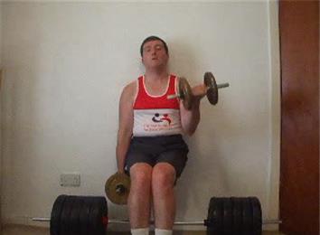 Longest Wall Sit While Arm Curling Two 22.5-Pound Dumbbells | World ...