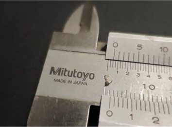 Smallest Paper Airplane | World Record | Reto Schläfli