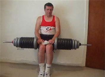 Longest Wall Sit While Carrying A 100-Pound Barbell | World Record ...