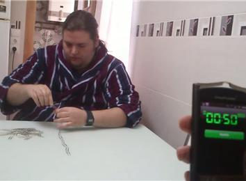 Most Paper Clips Unclipped In One Minute | World Record | Adrian Macia