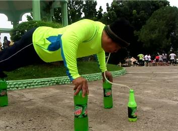Most Consecutive Push-Ups Performed On Four Soda Bottles While Drinking ...