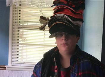 Most Hats Worn While Wearing Four Jackets At Once | World Record ...