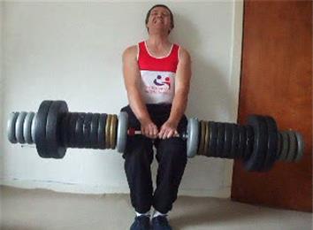 Longest Wall Sit While Carrying A 265-Pound Barbell | World Record ...