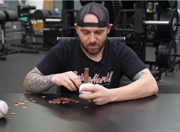Tallest Penny Tower Stacked On Baseball Held In Hand | World Record ...