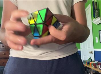 Fastest Time To Solve A Pyraminx While Hopping On One Leg | World ...