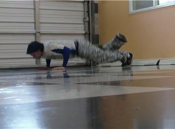 Most One-Legged Burpee Exercises While Holding A Yoga Block Between ...