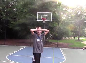 Farthest Behind-The-Back Shot Of A Football Into A Basketball Hoop ...