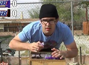 Most Snickers Bars Eaten While Planking | World Record | Naader Reda