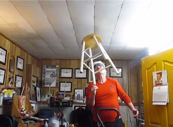 Longest Time Balancing A Hardwood Stool On Thumb While Stepping On A ...
