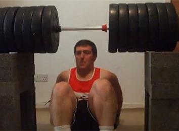 Longest Time Balancing A 450-Pound Barbell Using Both Feet And Hands ...