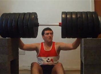 Longest Time Balancing A 500-Pound Barbell Using Both Feet And Hands ...
